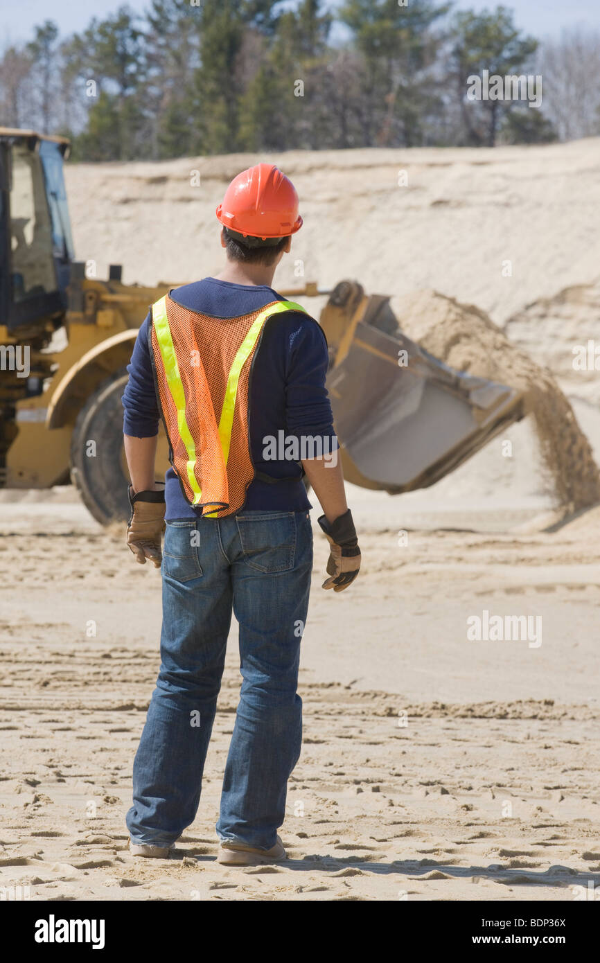 Engineer standing at a plant Stock Photo - Alamy