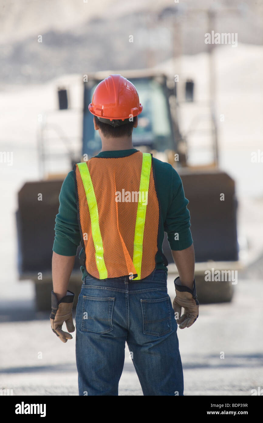 Engineer standing at a plant Stock Photo - Alamy
