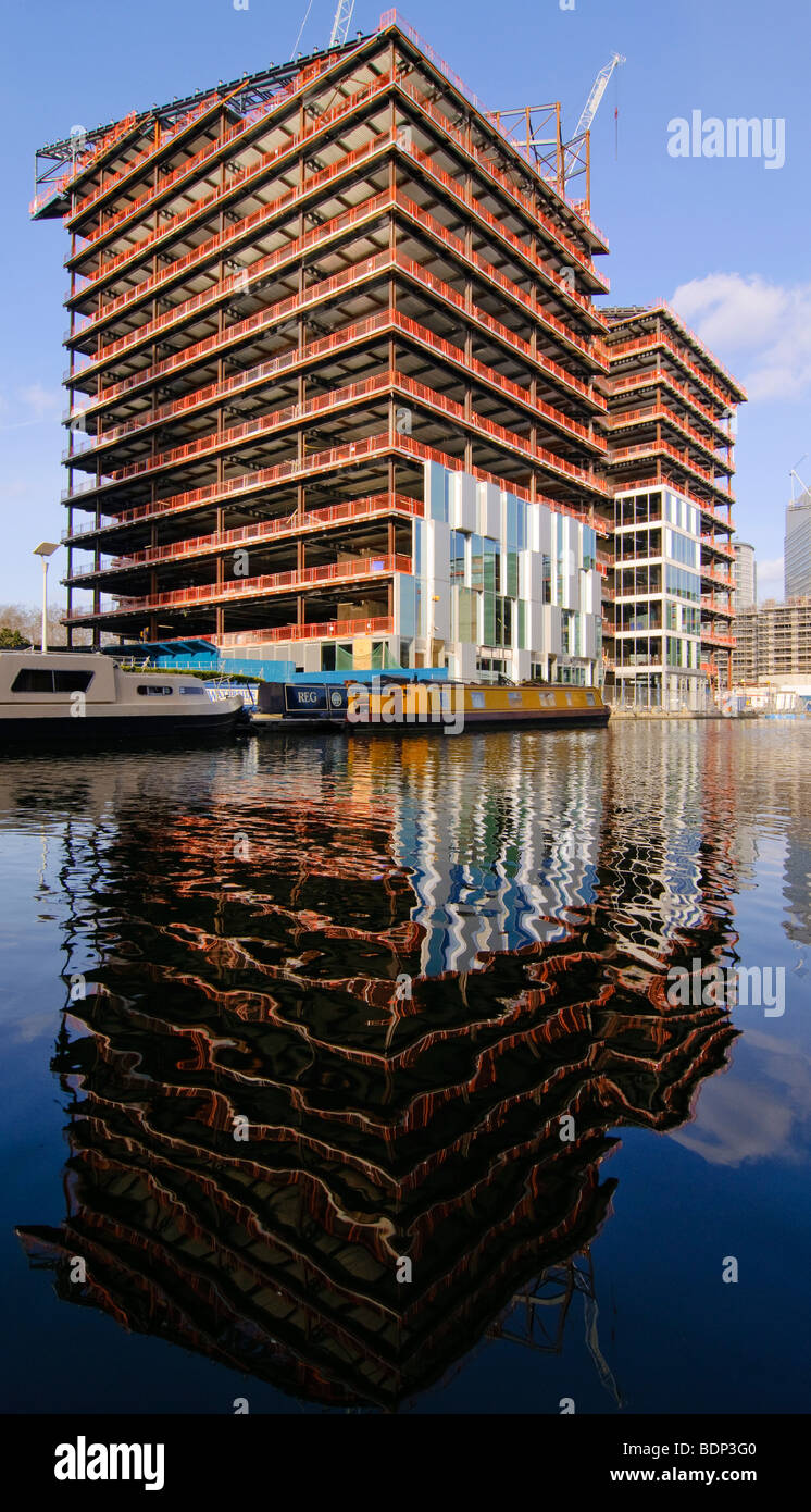 Orange building reflected Stock Photo - Alamy