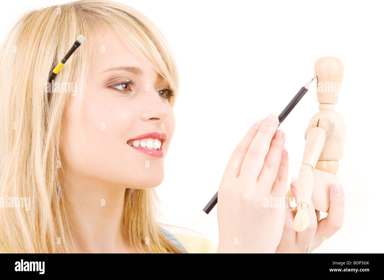 happy teenage girl with wooden model dummy over white Stock Photo - Alamy
