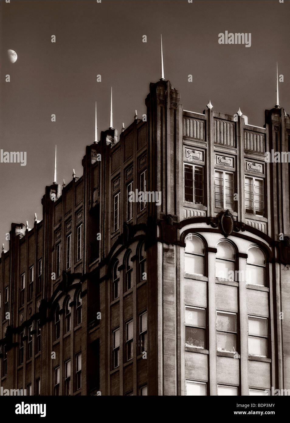 A tall gothic building with moon Stock Photo - Alamy