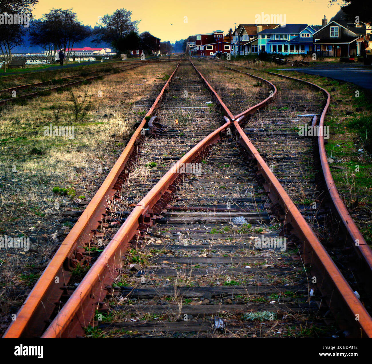 Dividing train tracks in USA town Stock Photo - Alamy