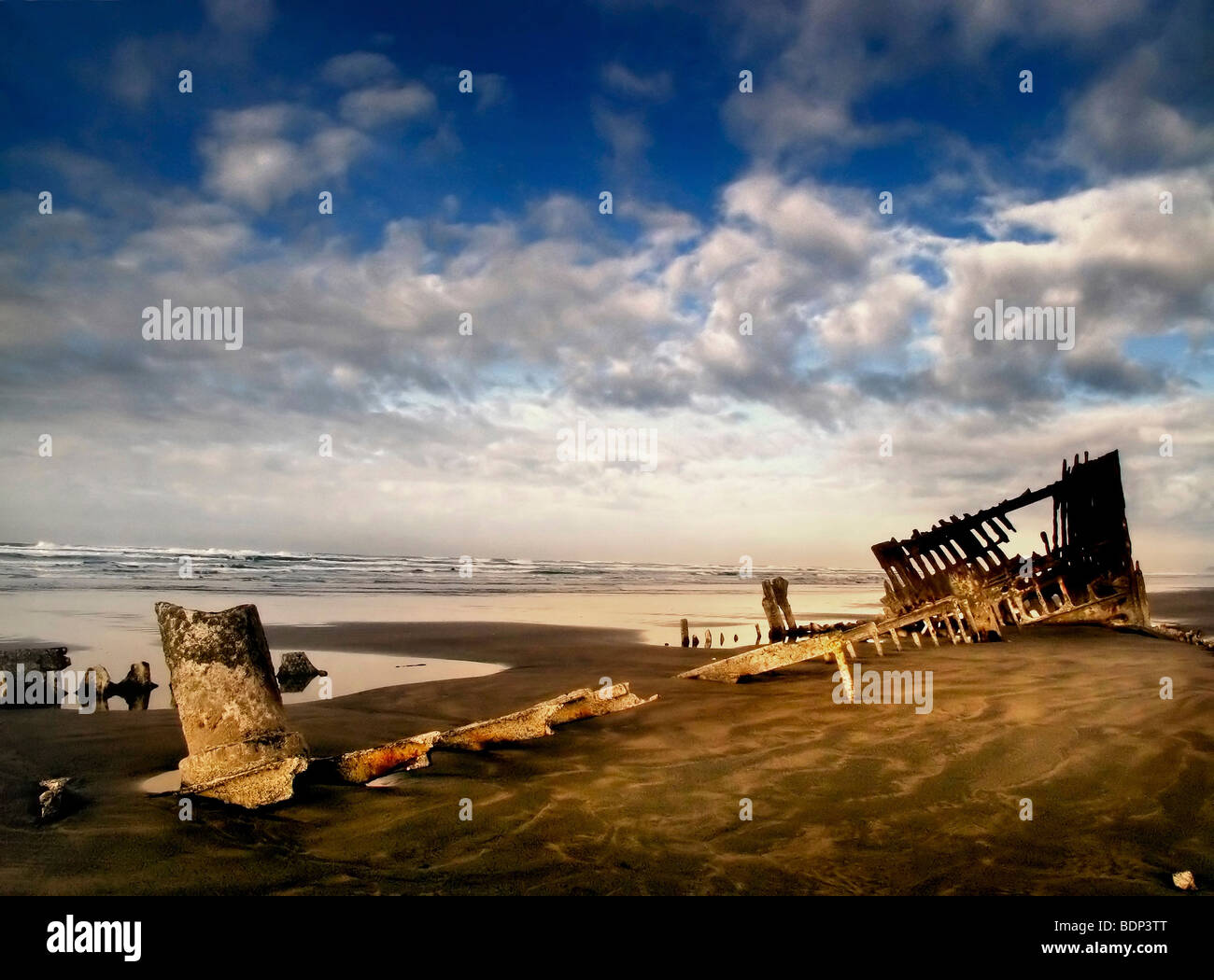 Shipwreck on a beach Stock Photo - Alamy