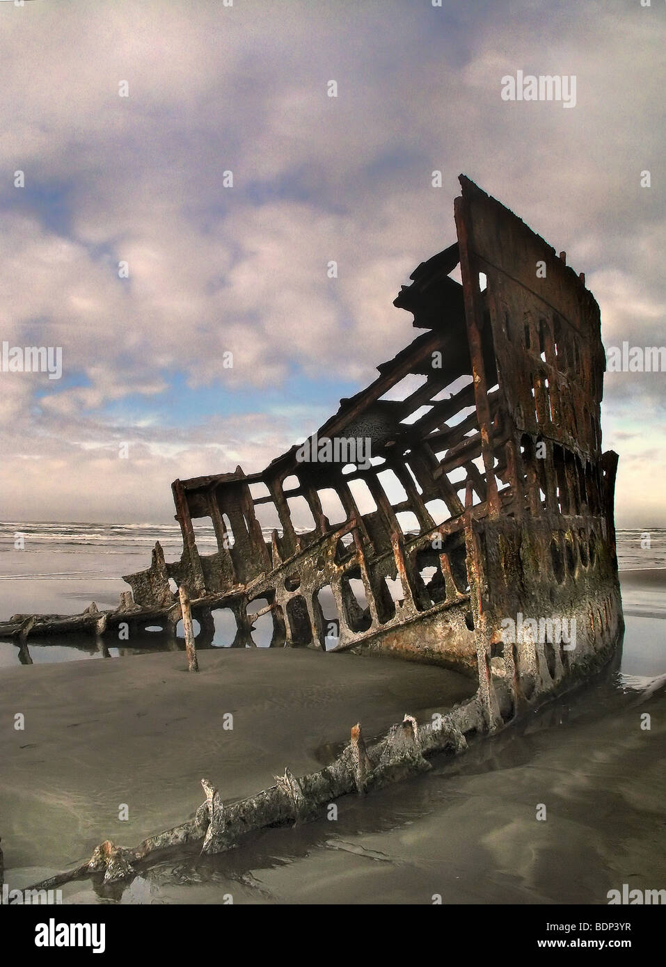 Shipwreck on a beach with rust Stock Photo - Alamy