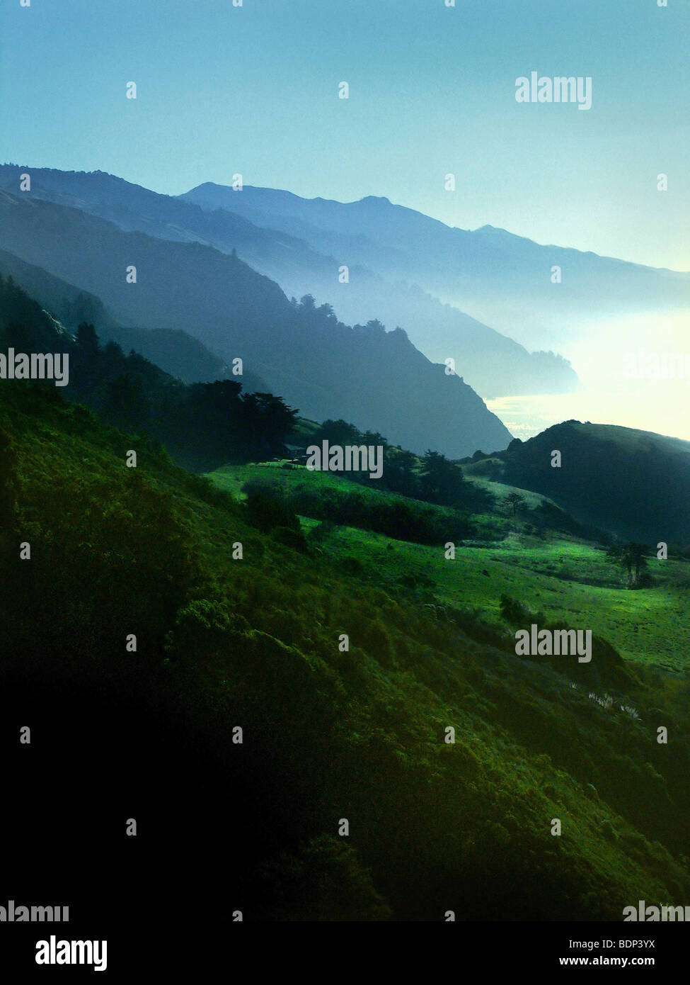 Rolling green fields on high ground looking down to coast in usa Stock ...