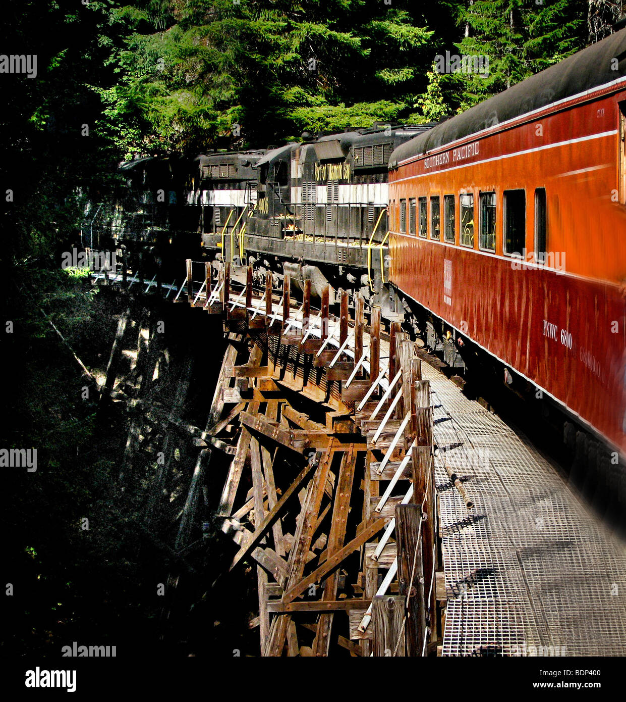 A train crossing a wooden bridge in USA Stock Photo - Alamy
