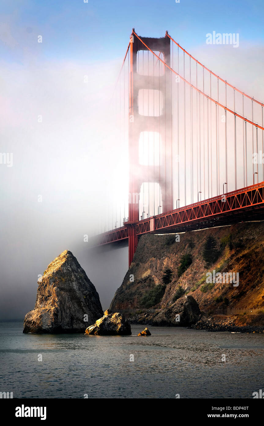 The Golden Gate bridge shrouded in mist at sunrise Stock Photo - Alamy