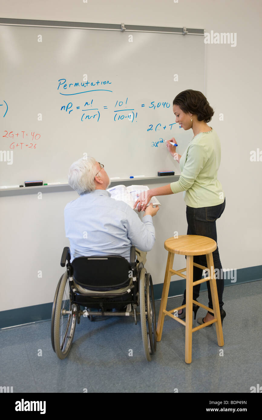 University professor teaching his student in a classroom Stock Photo ...