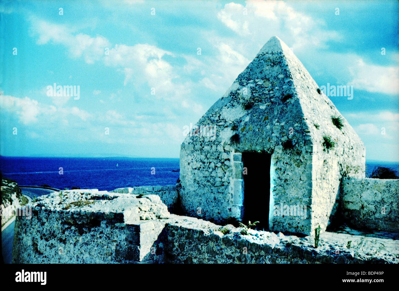A small building with a triangular roof Stock Photo - Alamy