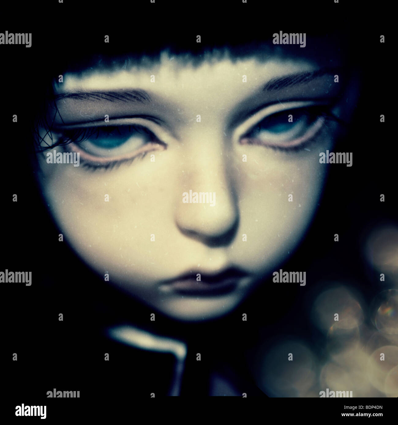 portrait of a sad doll with dark hair and blue eyes Stock Photo - Alamy
