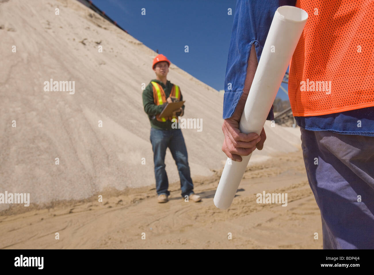 Midsection two engineers working blueprint hi-res stock photography and ...