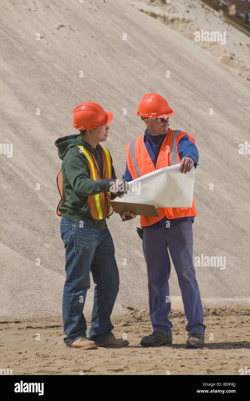 Two engineers planning at a plant Stock Photo - Alamy