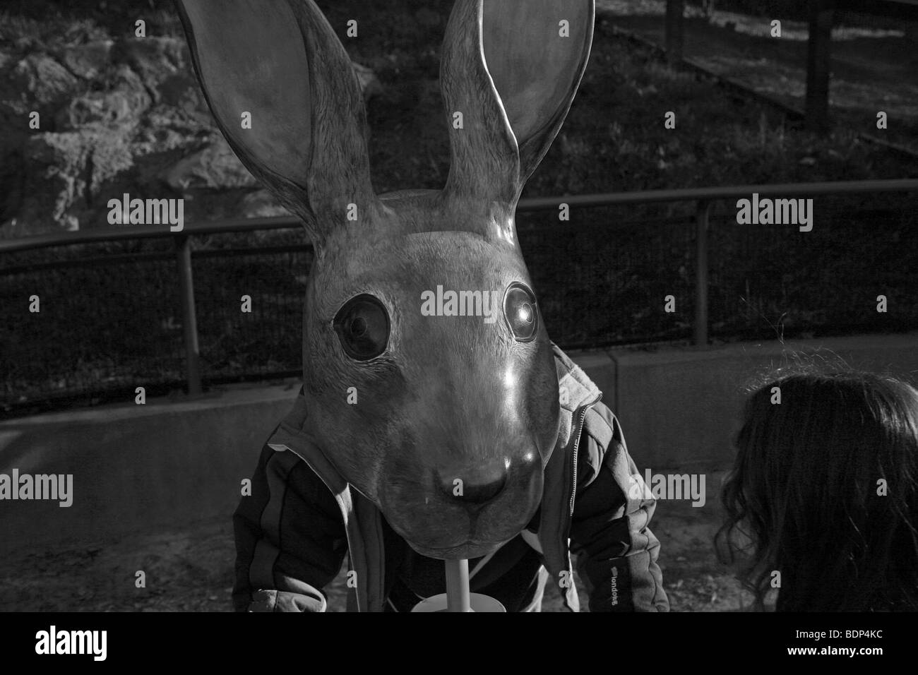 A large rabbits head superimposed onto a childs body Stock Photo - Alamy