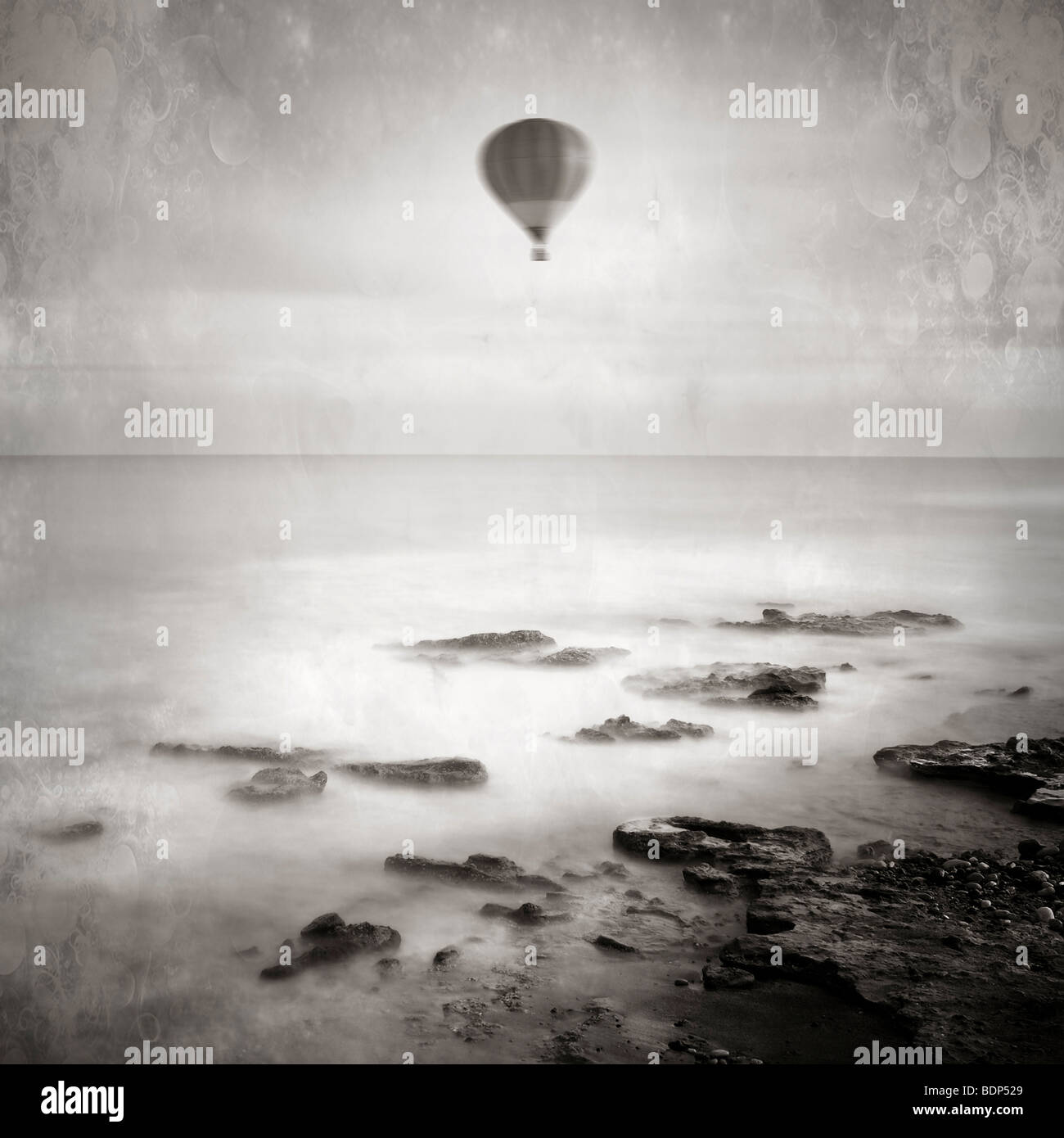 A hot air balloon floating above the sea Stock Photo - Alamy