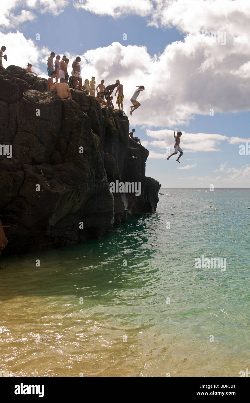 People jumping off rocks sea hi-res stock photography and images - Alamy