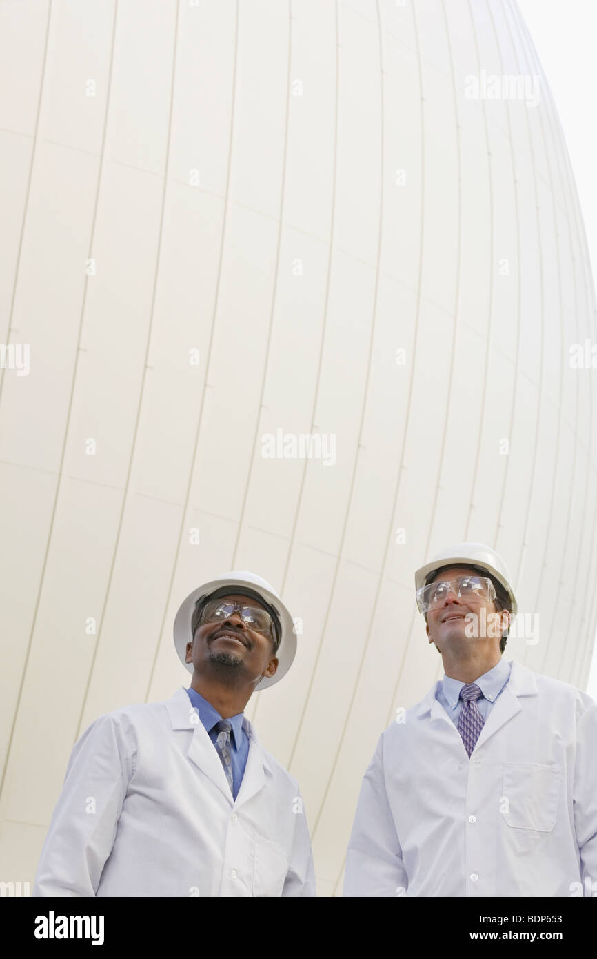 Two scientists standing in front of a digester tank Stock Photo - Alamy Two scientists standing in front of a digester tank Stock Photo - Alamy