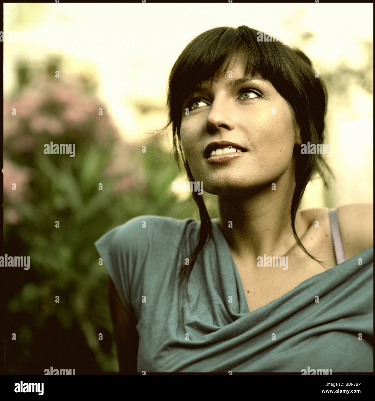 A young woman looking upwards Stock Photo - Alamy
