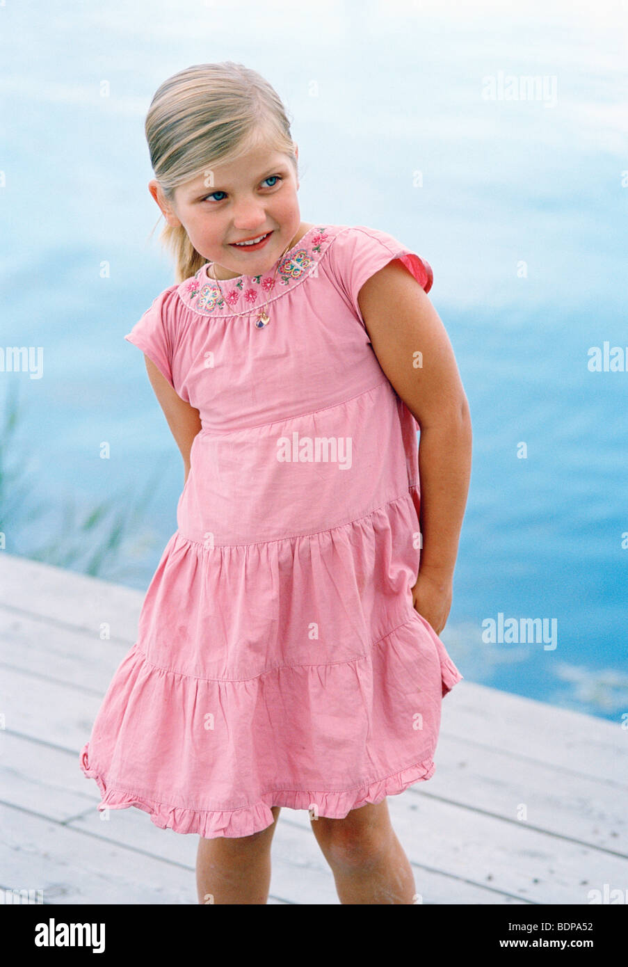 Girl wearing a pink dress hi-res stock photography and images - Alamy
