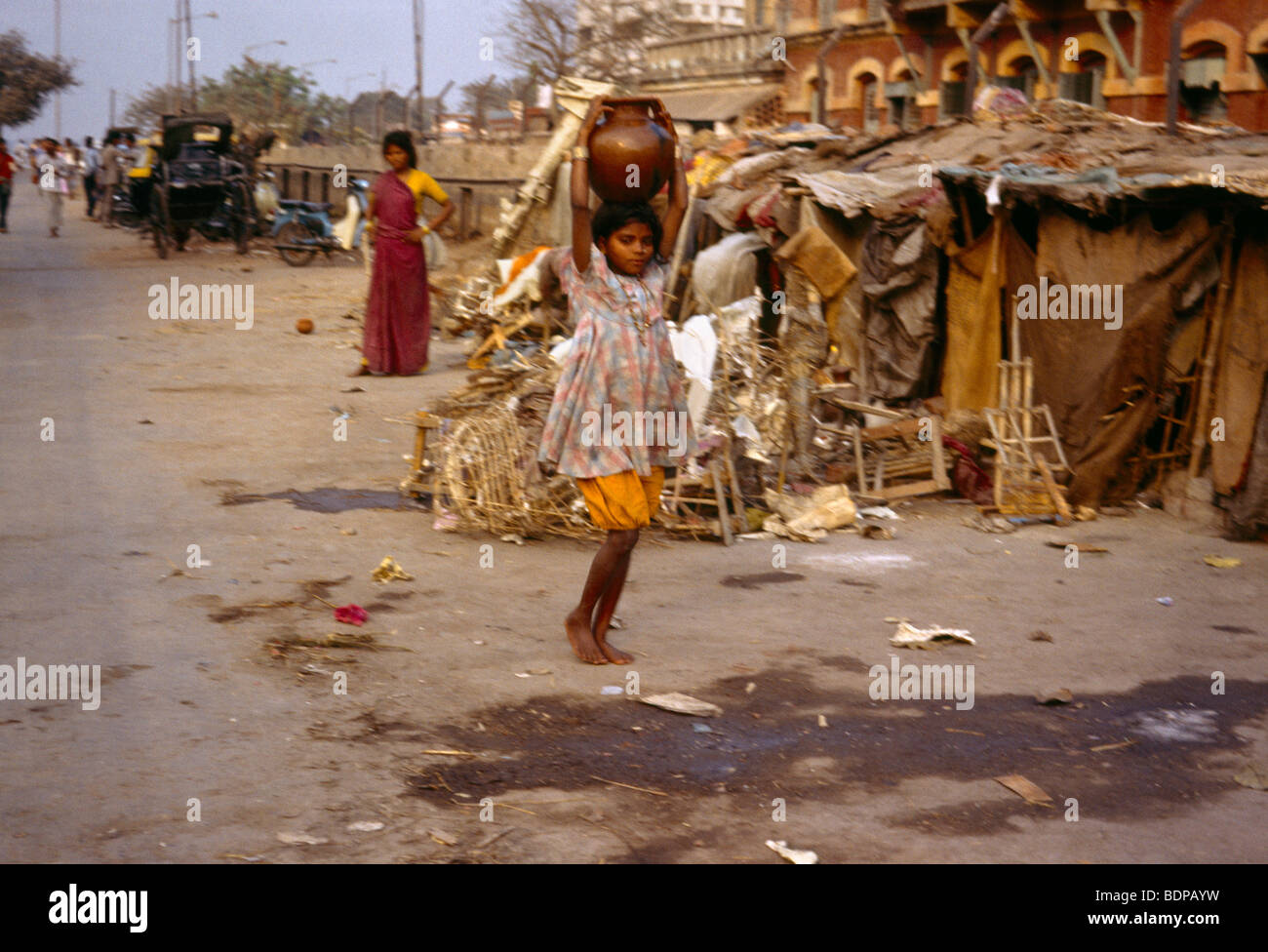 Calcutta India Child Carrying Water Pot - Slums Stock Photo - Alamy