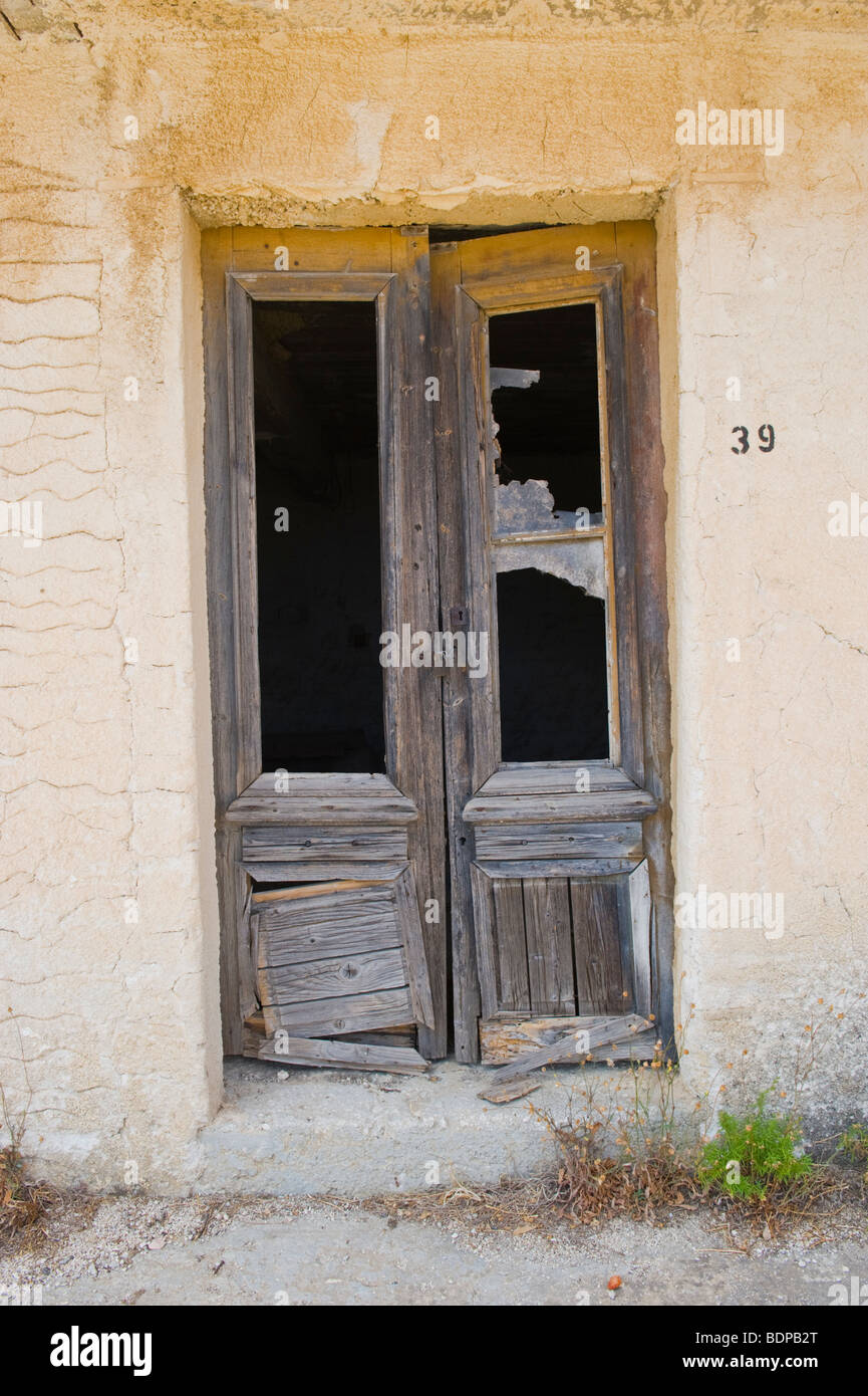 Front door of derelict village house at Markopoulo on Greek island of ...