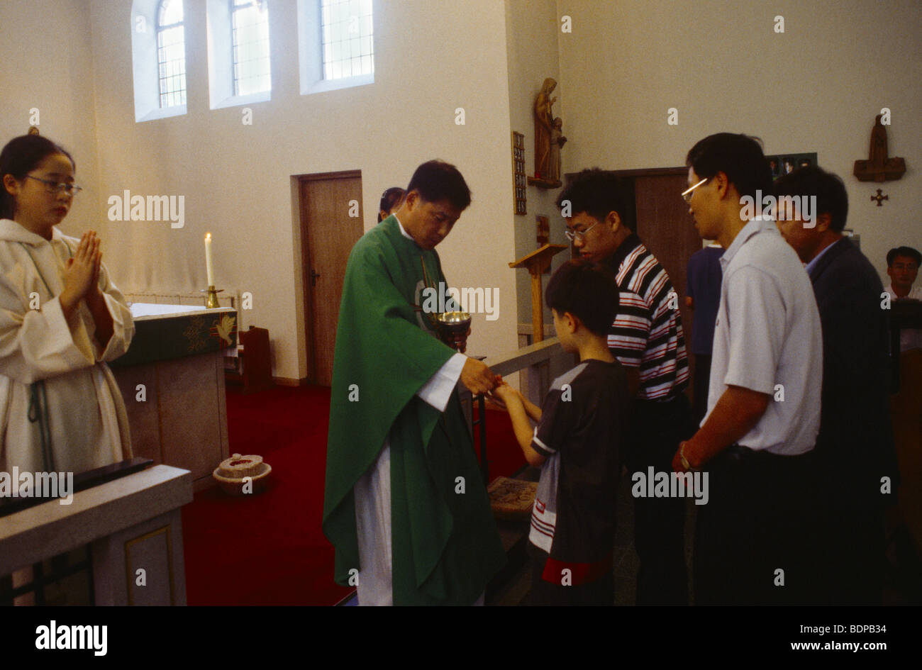 St Anne's Catholic Church Korean Mass Communion Stock Photo - Alamy