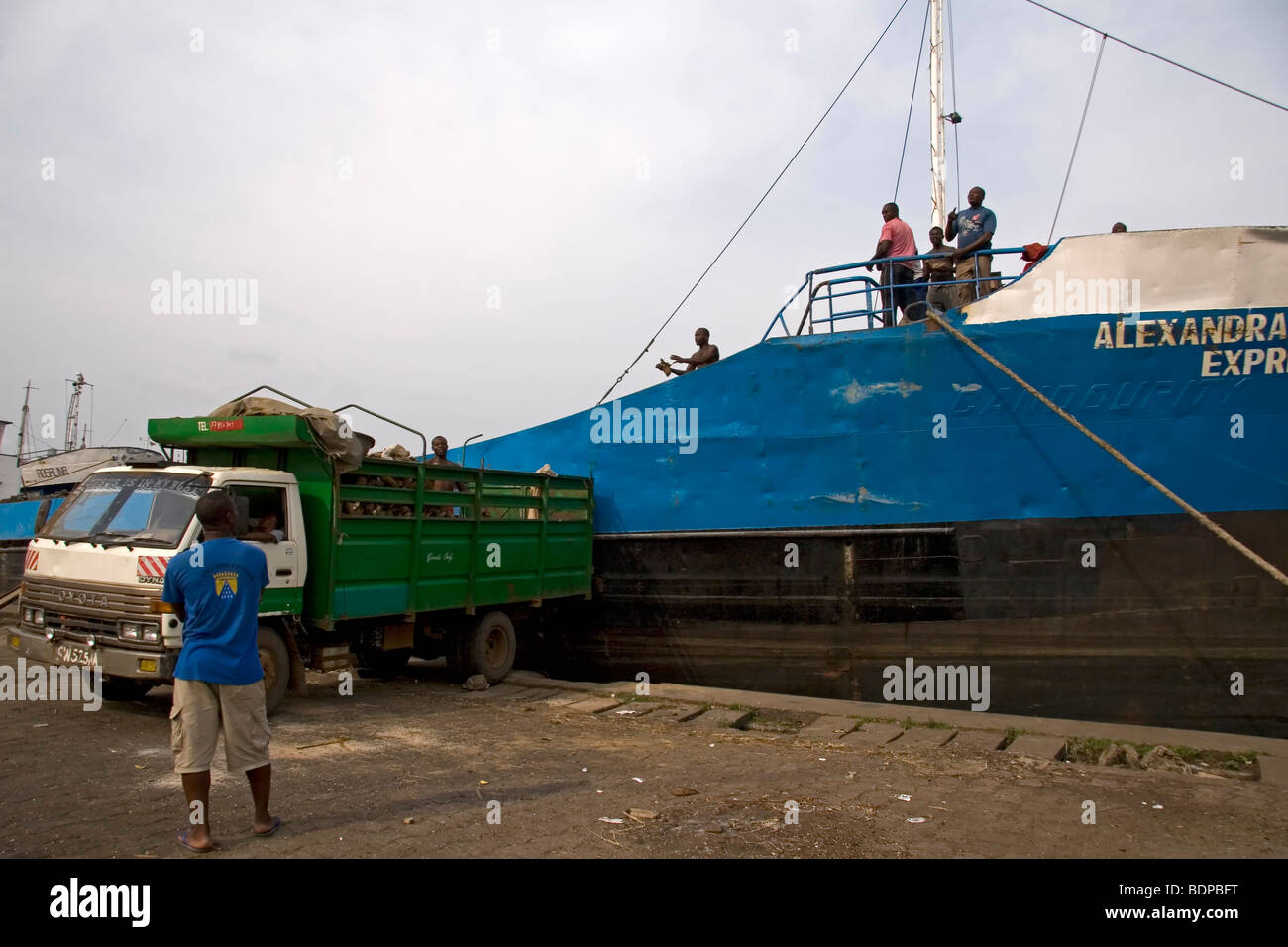 Dock scene at Douala Cameroon West Africa with yams being loaded onto ...