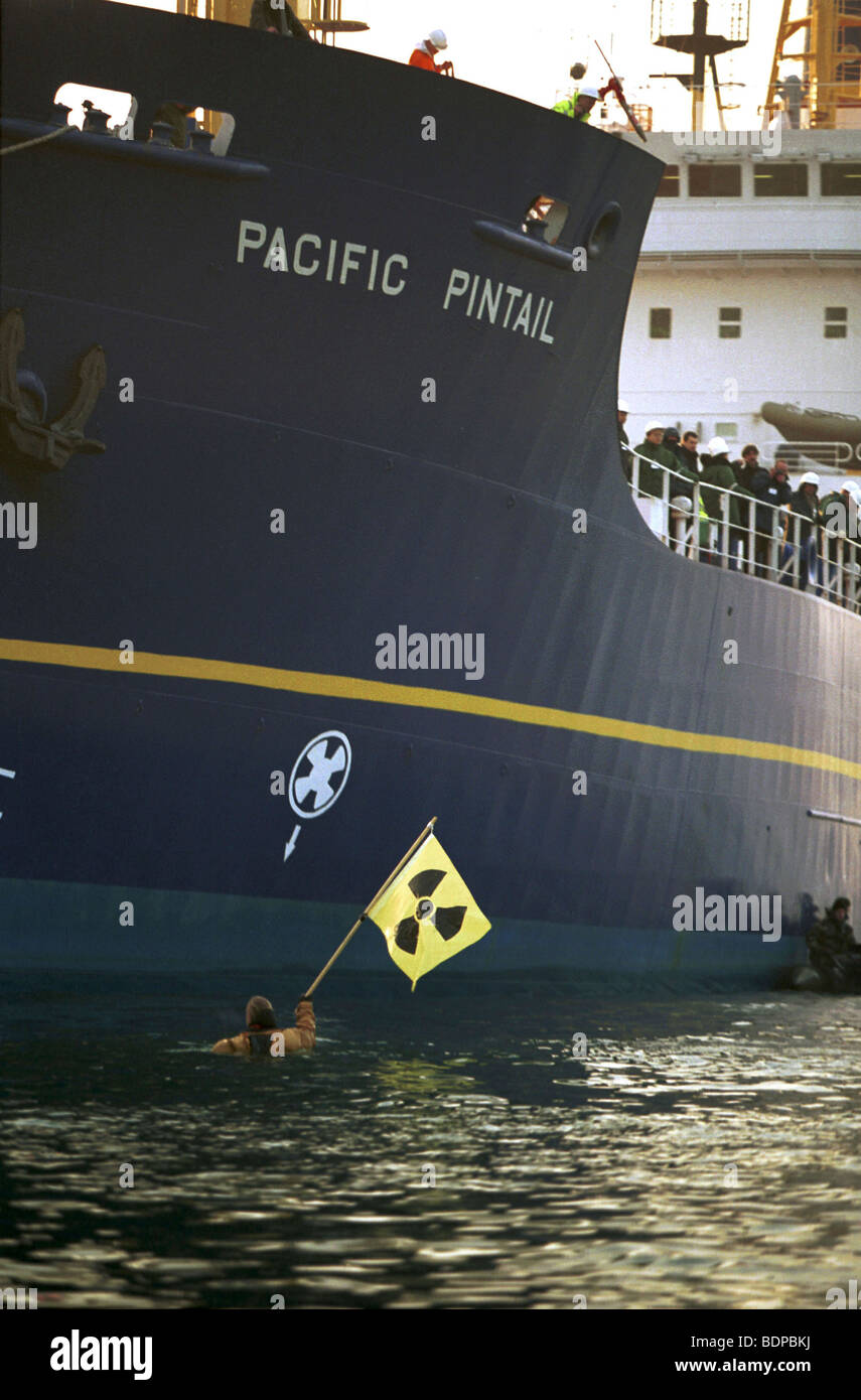 GP activists holding flags bearing the radiation symbol in the water ...