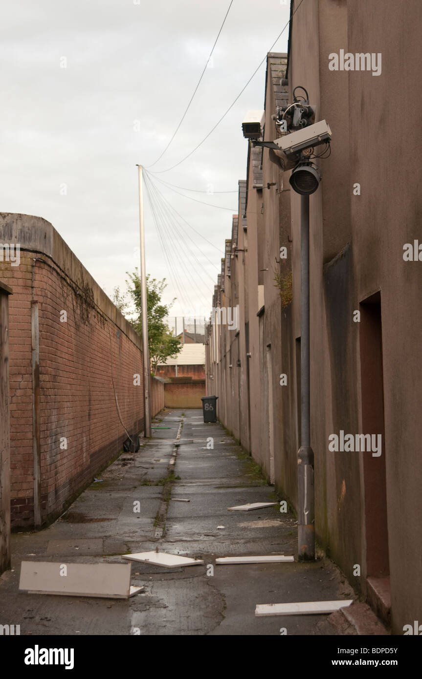 CCTV cameras monitor a narrow back entry/alley/alleyway Stock Photo - Alamy