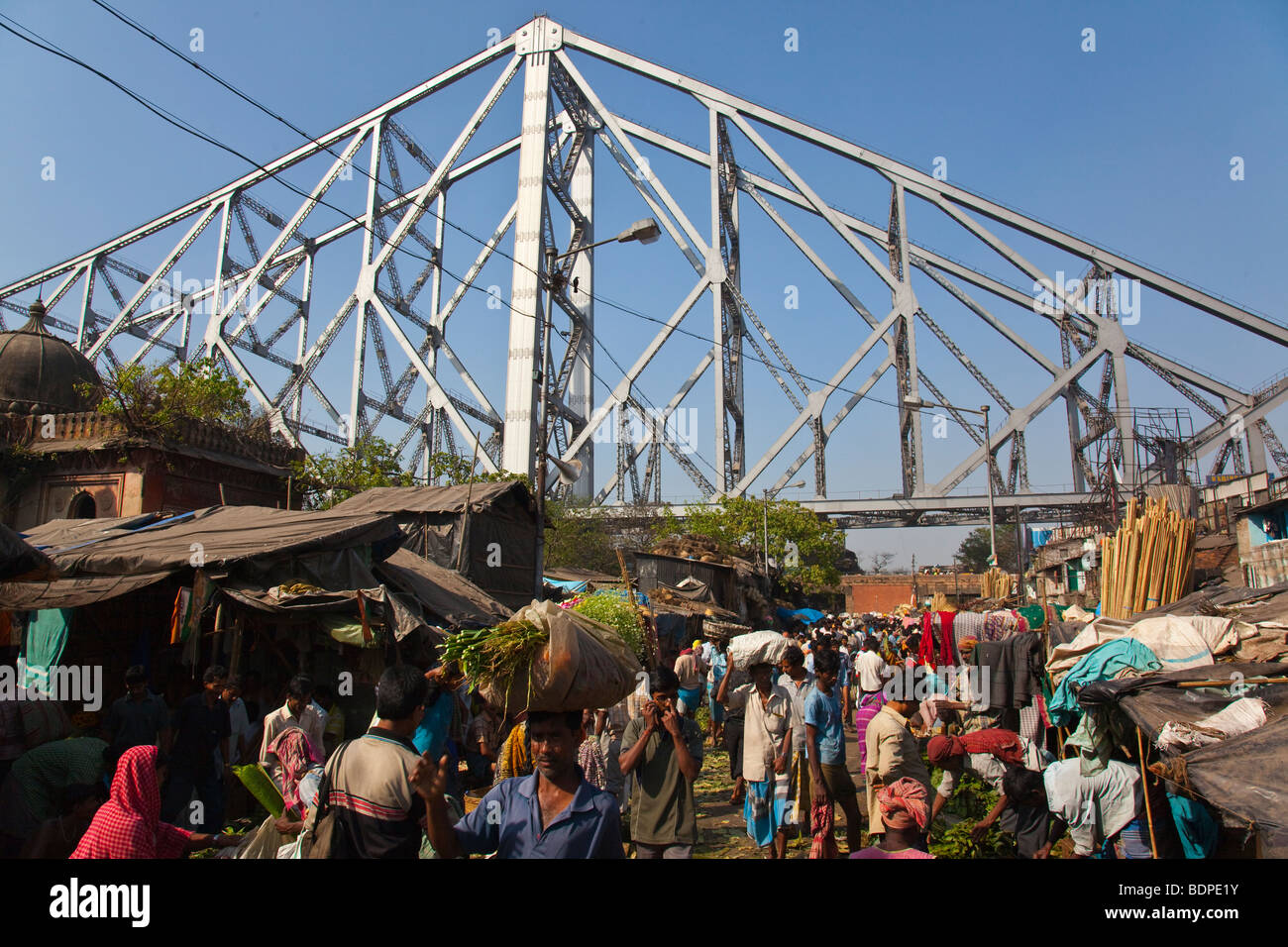 Howrah Bridge behind an outoodr market in Calcutta India Stock Photo ...