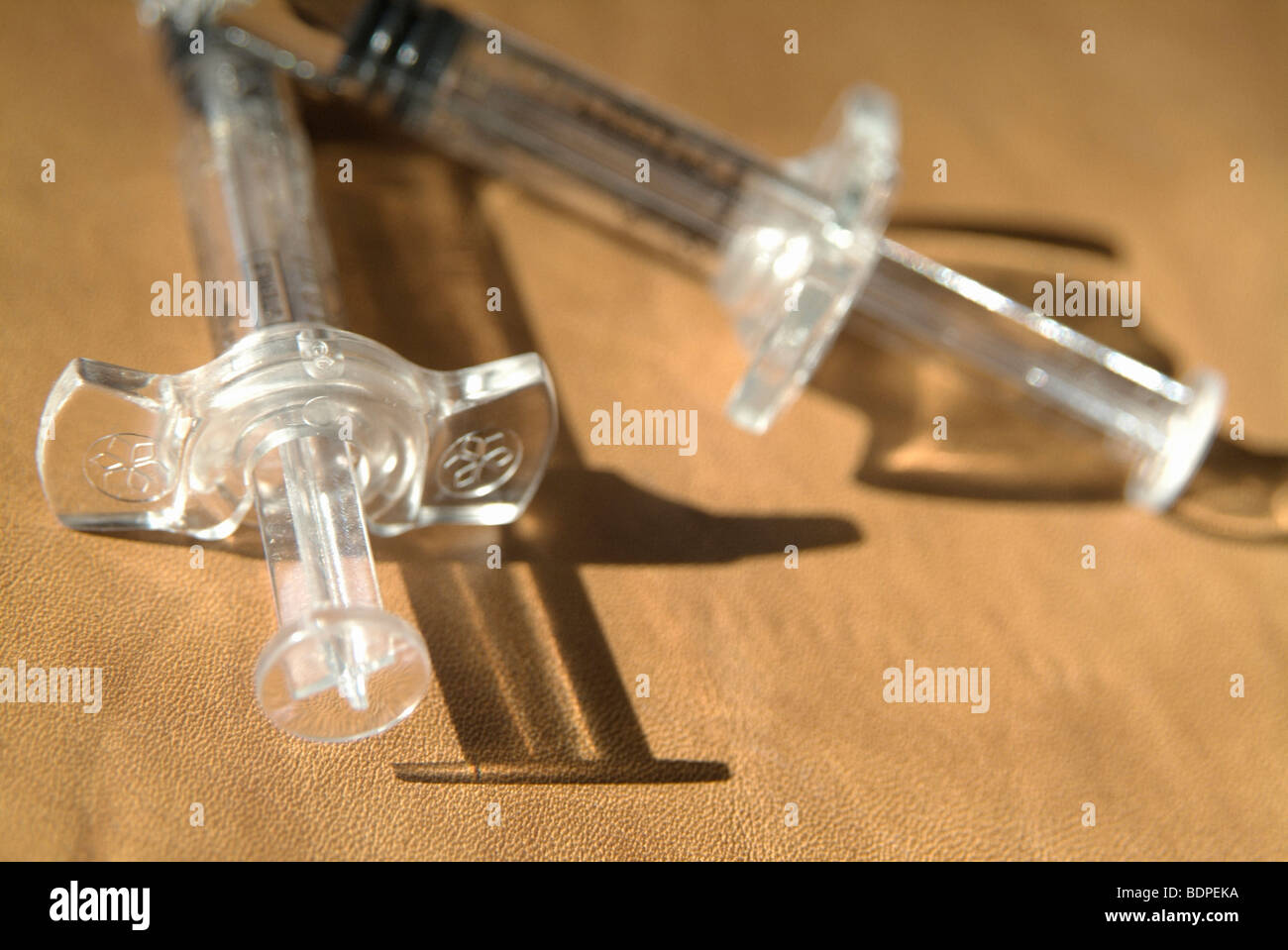 Closeup of a pair of syringes Stock Photo - Alamy