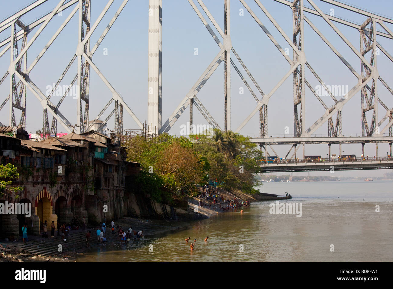 Former British Colonial Boat Docks and Howrah Bridge in Calcutta India ...