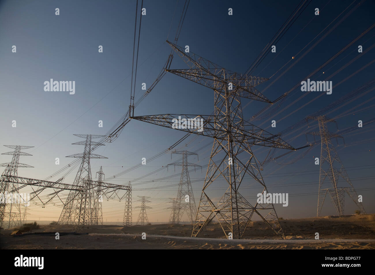 Transmission power line cables towers lines tower Stock Photo - Alamy