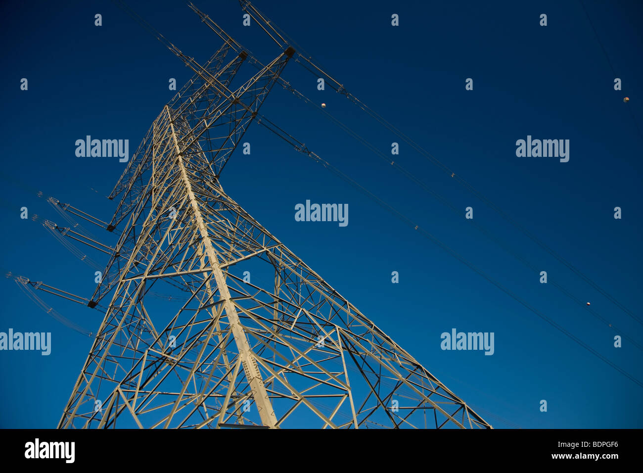 Transmission power line cables towers lines tower Stock Photo - Alamy