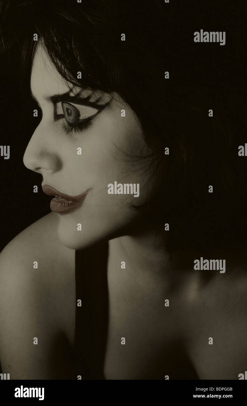 A young woman wearing bold face makeup Stock Photo - Alamy