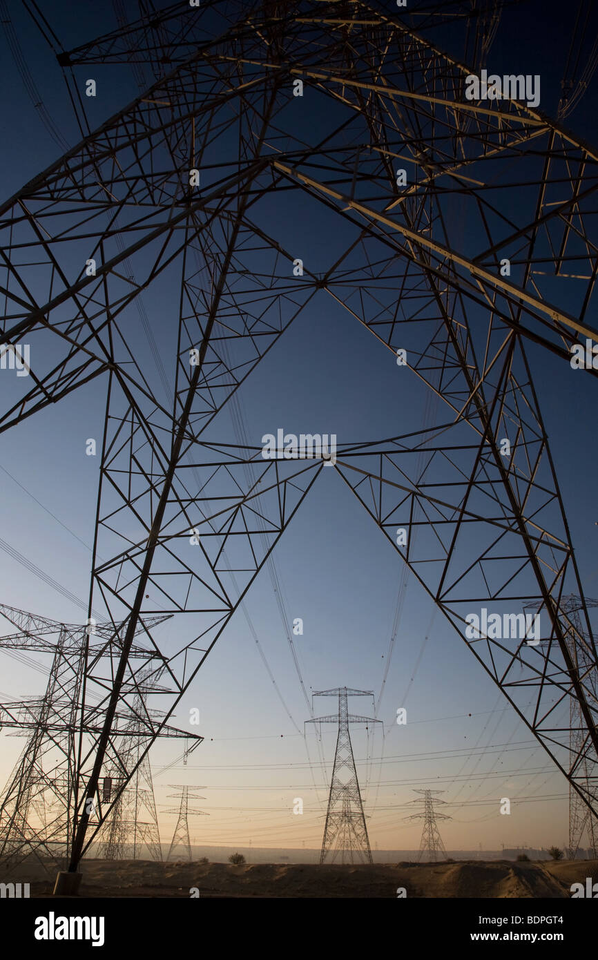 Transmission power line cables towers lines tower Stock Photo - Alamy