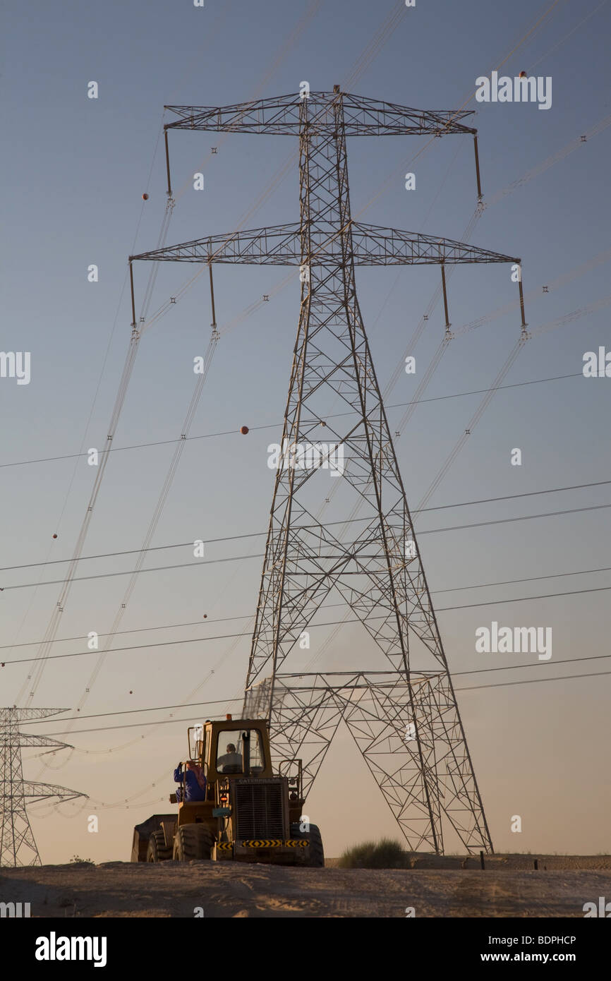 Transmission power line cables towers lines tower Stock Photo - Alamy