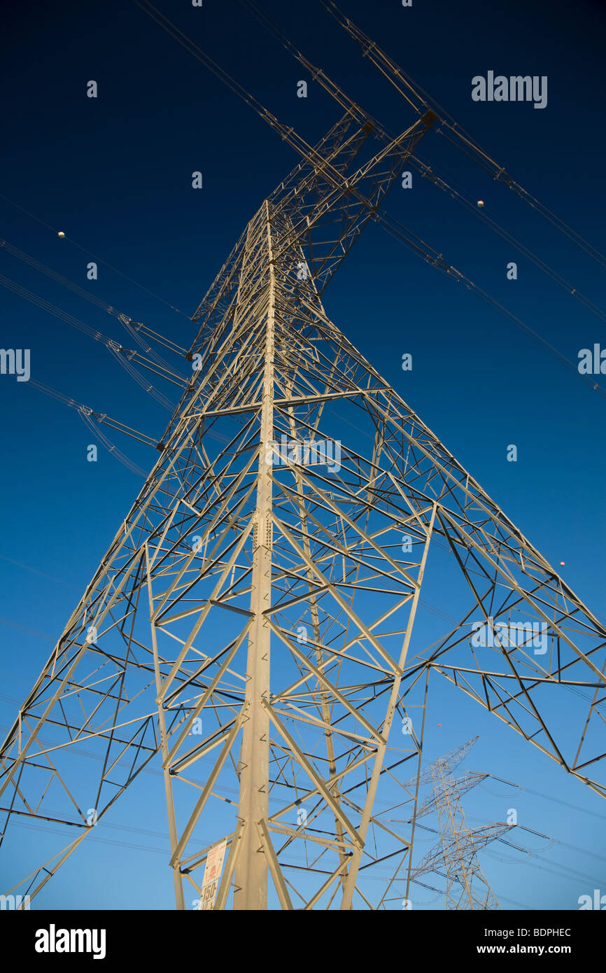 Transmission power line cables towers lines tower Stock Photo - Alamy