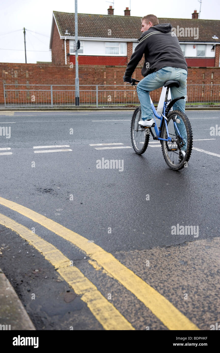 A cyclist prepares to turn right at a junction Stock Photo - Alamy