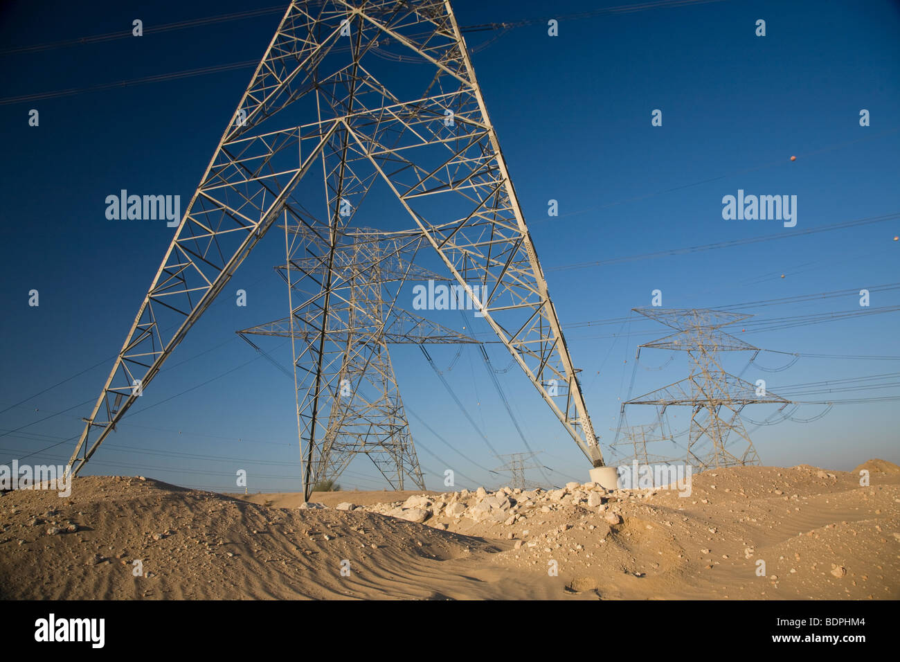 Transmission power line cables towers lines tower Stock Photo - Alamy