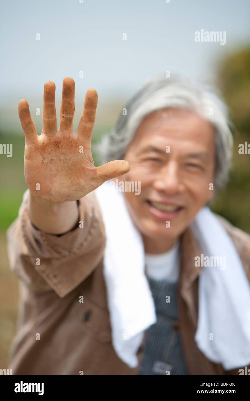 Senior man reaching forward his hand Stock Photo: 25698736 - Alamy
