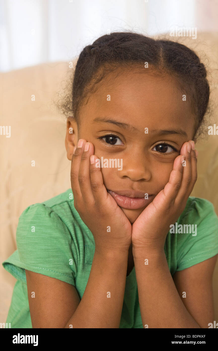 Portrait of a Hispanic girl looking serious Stock Photo - Alamy