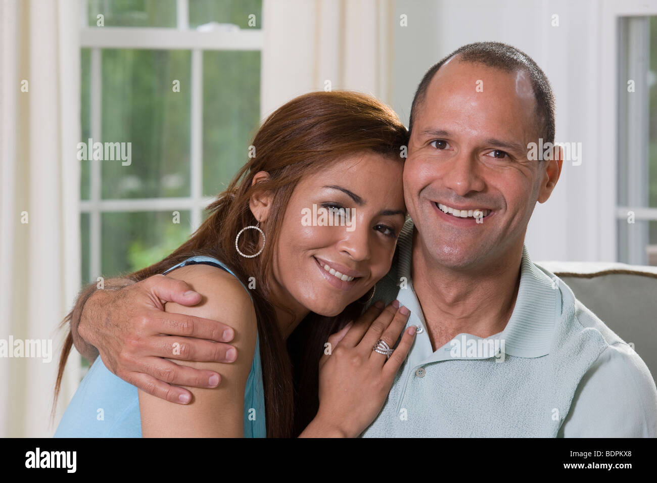 Portrait of a Hispanic couple smiling Stock Photo - Alamy