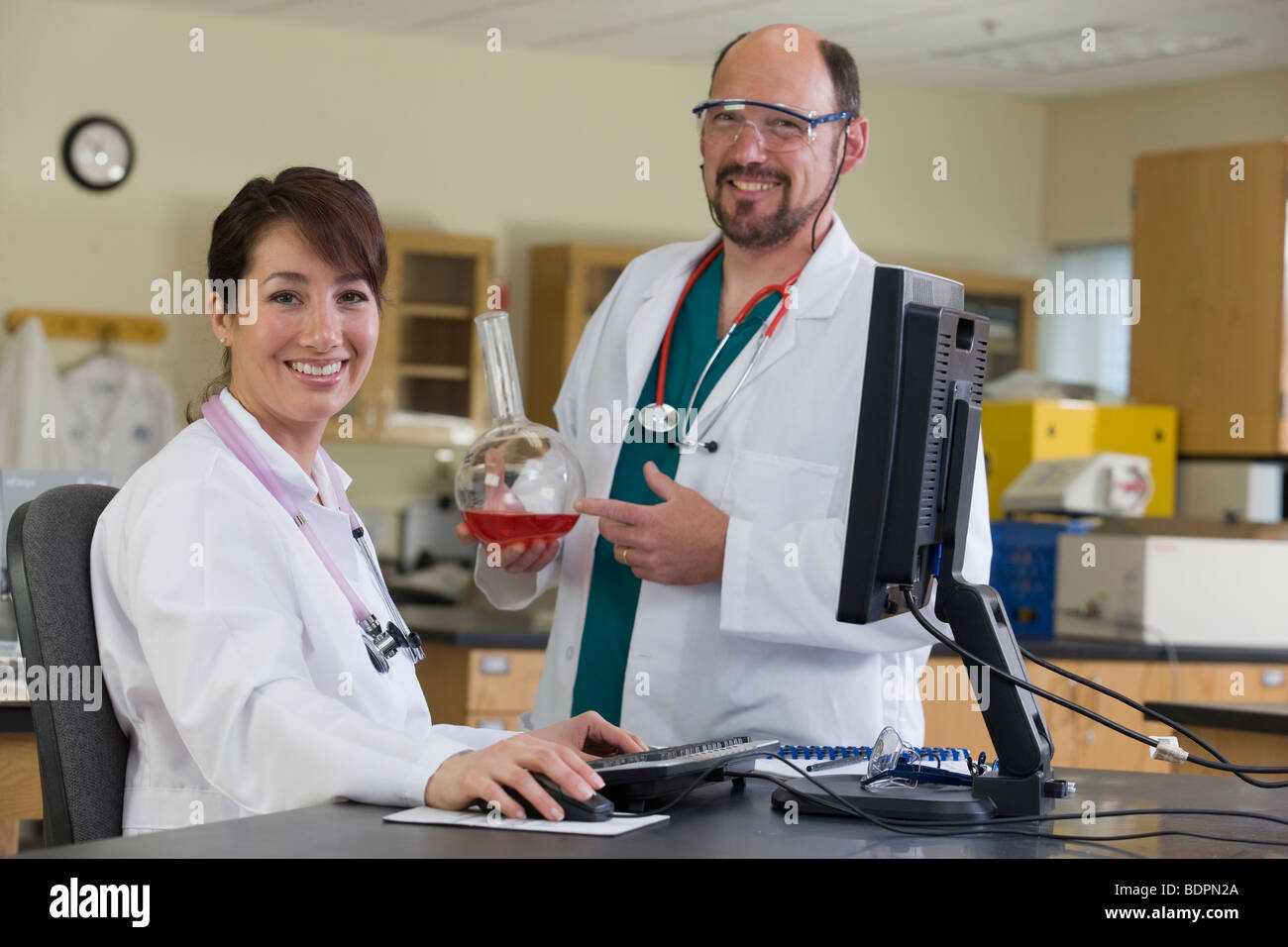 Portrait of two scientists smiling Stock Photo - Alamy