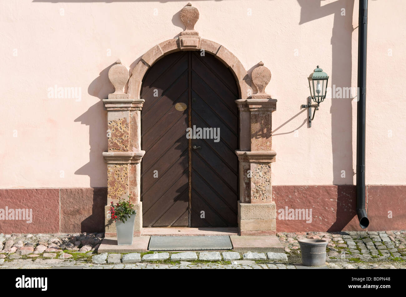 Wooden entrance door to one of the wings of a small medieval castle in ...
