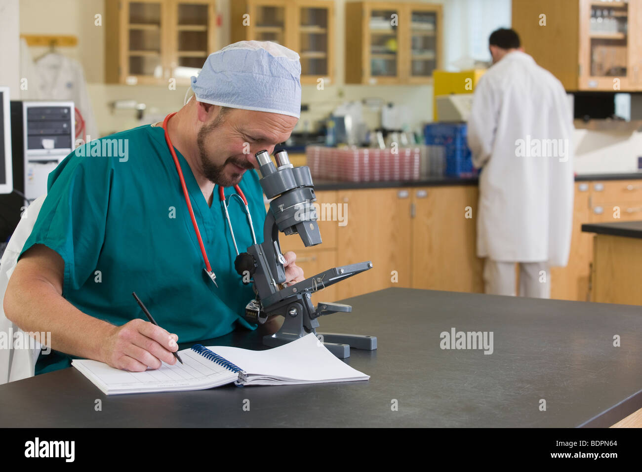 Microscope Looking Bacteria High Resolution Stock Photography and ...