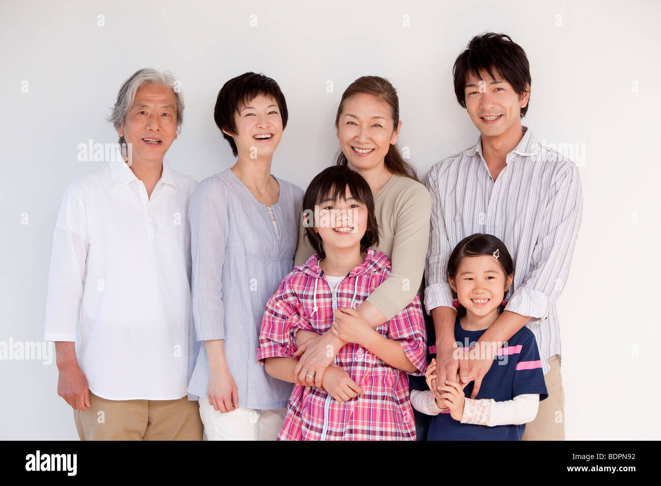 Multi generation family smiling Stock Photo - Alamy