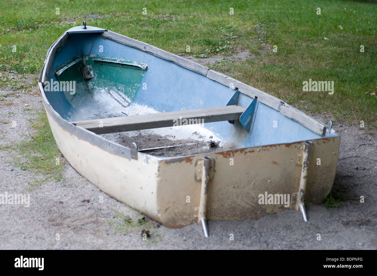 Small rowing boat on the ground Stock Photo - Alamy