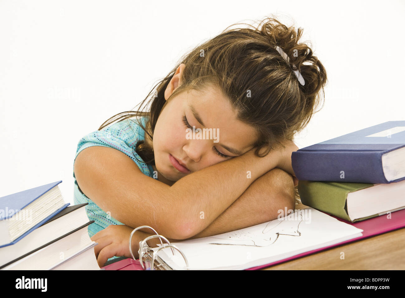 Child sleeping while working on homework on white background Stock ...