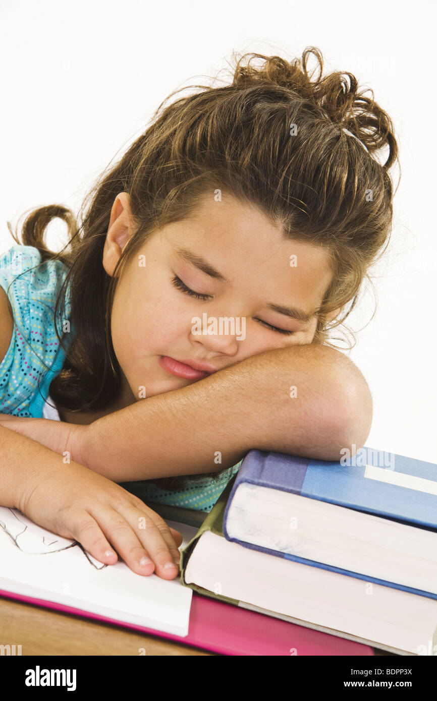 Child sleeping while working on homework on white background Stock ...