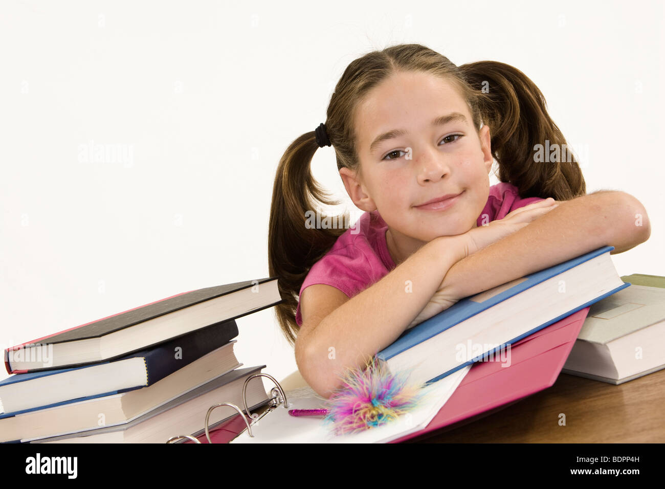Child working on homework on white background Stock Photo - Alamy